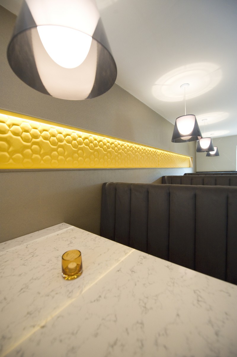 Acoustic panels in quilted wool by Cliq Designs Ltd | Archello