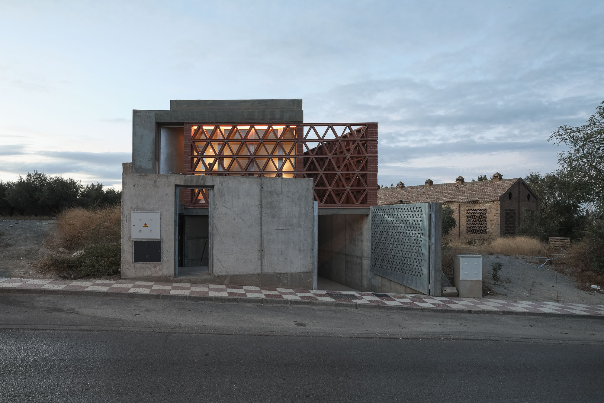 Folded wing roof and ceramic lattice define the Soledad Sevilla Studio ...
